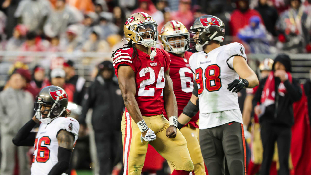 Jordan Mason Pushes through Defenders for a 13-Yard Gain