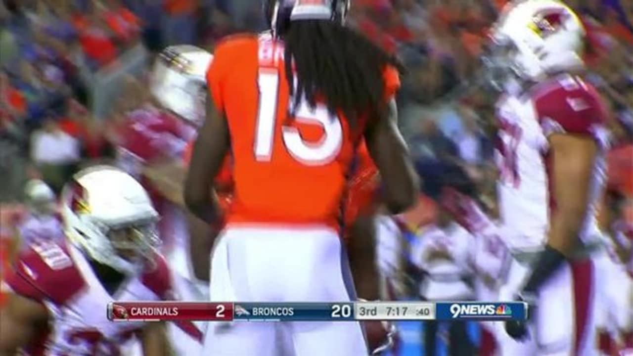 Austin Traylor comes down with catch surrounded by Cardinals