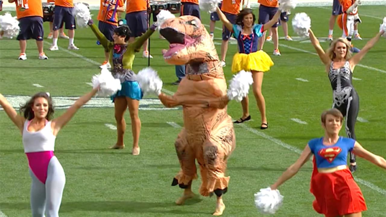 Broncos cheerleader dresses up as a dinosaur