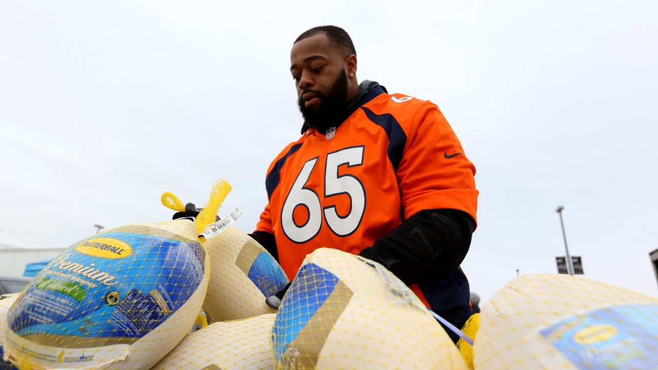 Broncos turn out for annual Thanksgiving Turkey Distribution