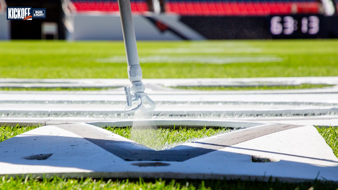 Empower Field receives game-day touches with fresh field painting