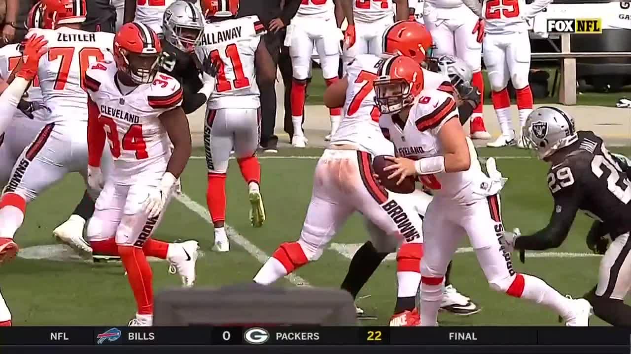 Baker Mayfield passes for first down after a near sack