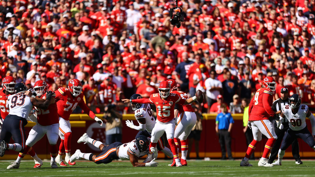 Kansas City Chiefs quarterback Patrick Mahomes avoids the pass rush and finds tight end Travis ...