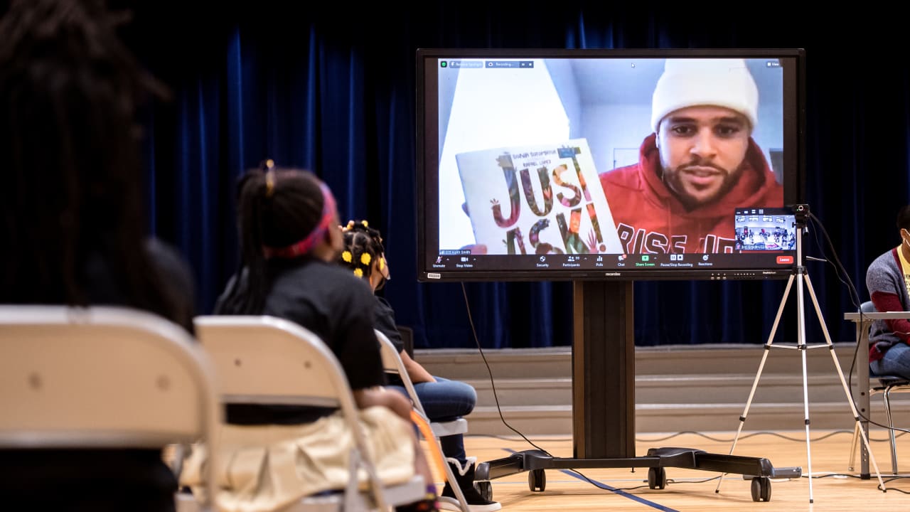 Falcons fullback Keith Smith participates in Tackle Reading Across ...