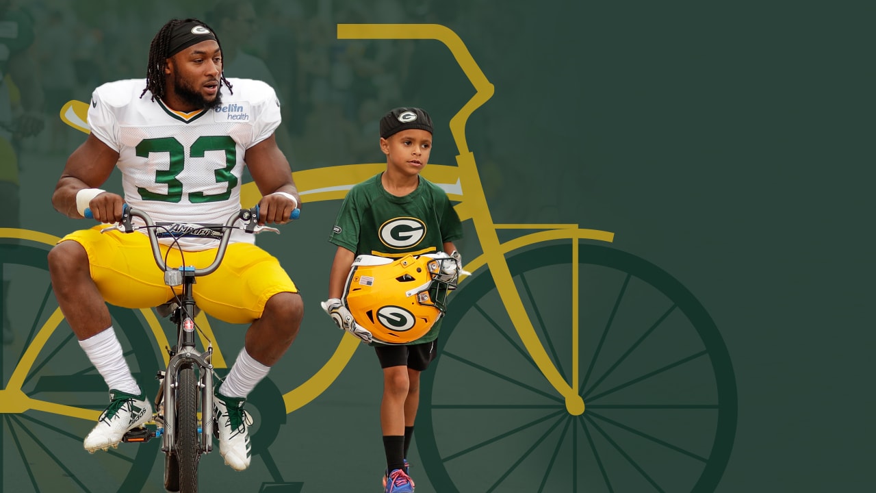 The boy, the bike, and the reason Aaron Jones rides