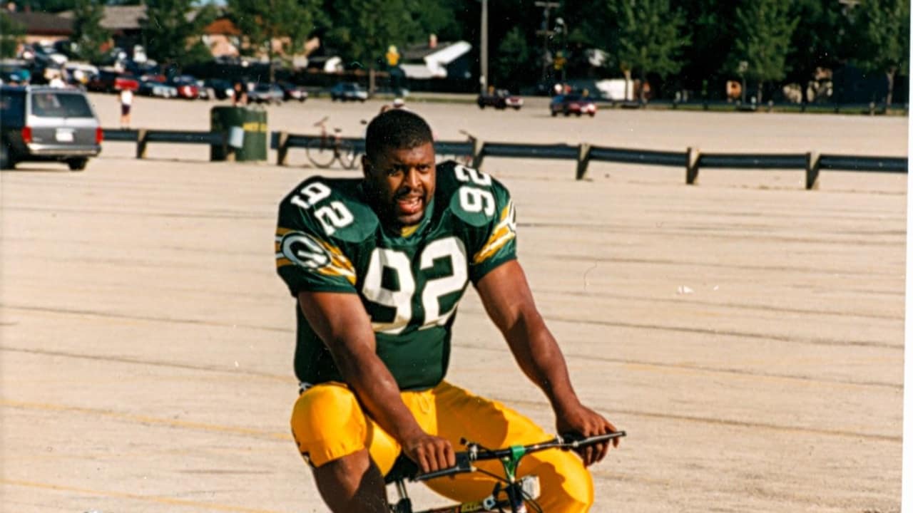 Packers riding kids' bikes through the years