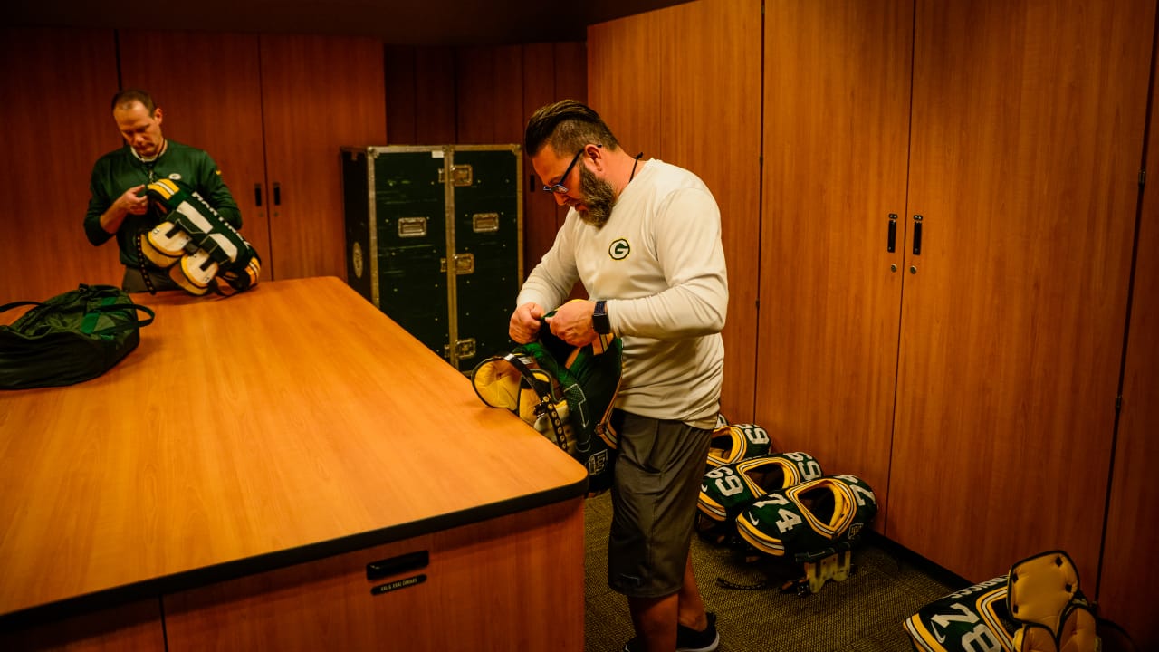 Equipment staff preps Packers' uniforms for Cardinals game