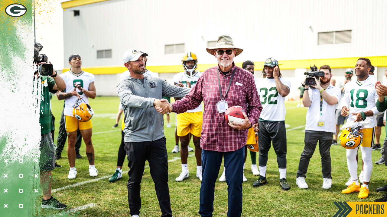 Matt LaFleur congratulates Larry McCarren on Packers training camp No. 50