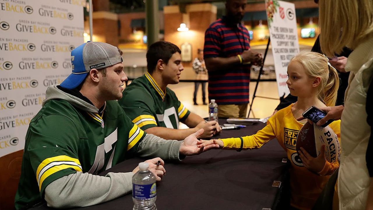 Martinez and Ryan sign autographs for donations to Salvation Army