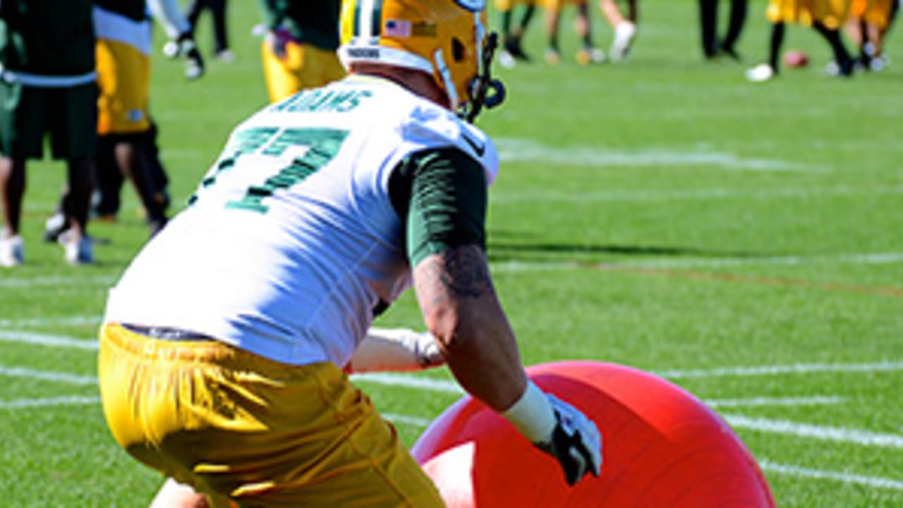 Packers release T Aaron Adams