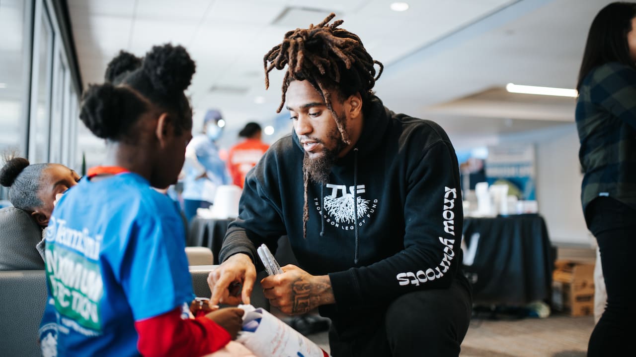 Shaq Thompson joins with Team Smile to help kids get teeth cleanings