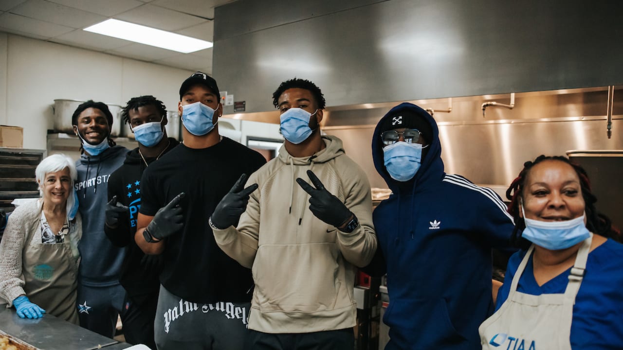 Jeremy Chinn, Panthers defenders serve meals at Roof Above