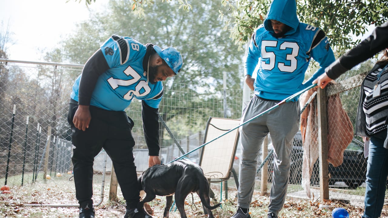 PHOTOS: Brian Burns, Marquan McCall visit animal shelter