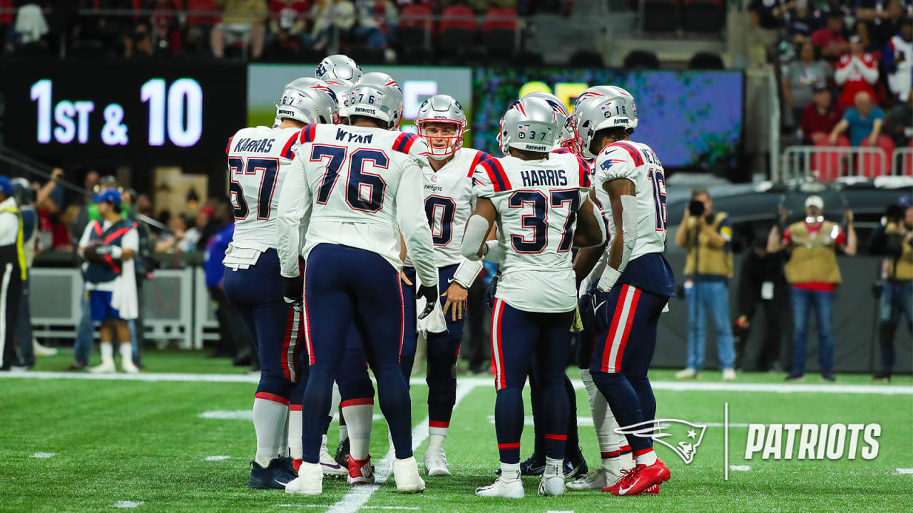 Patriots slide into first