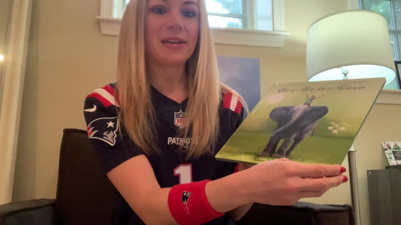 Patriots cheerleader Courtney reads "You're Here for a Reason"
