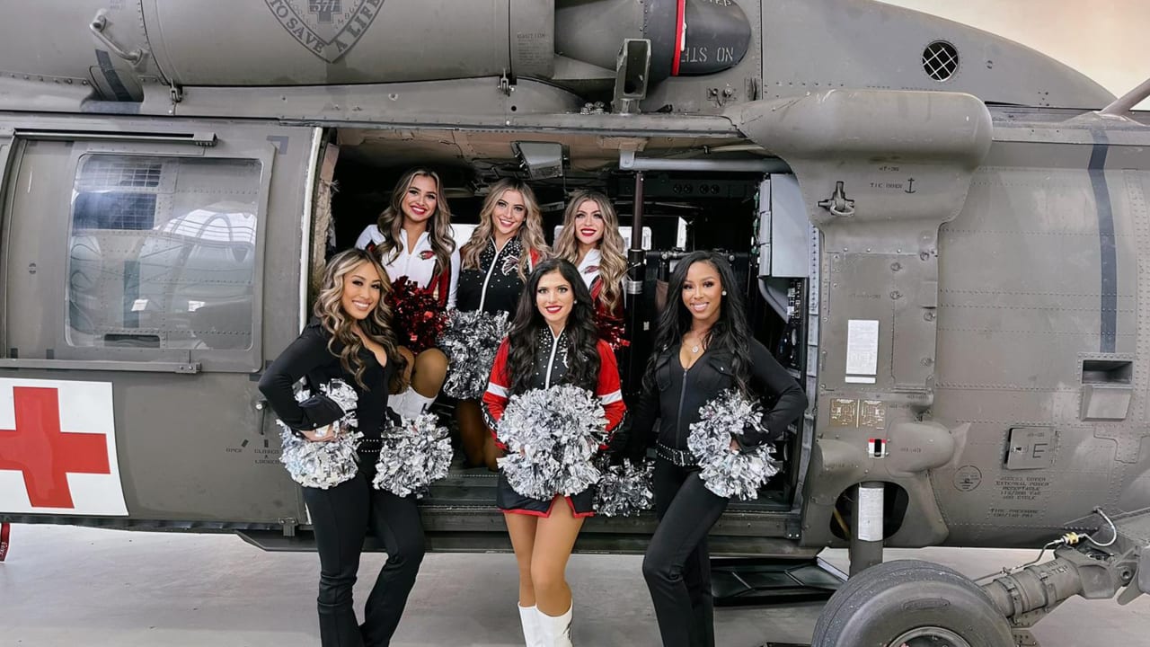 Raiderettes bring 'a little piece of home' to military families ...