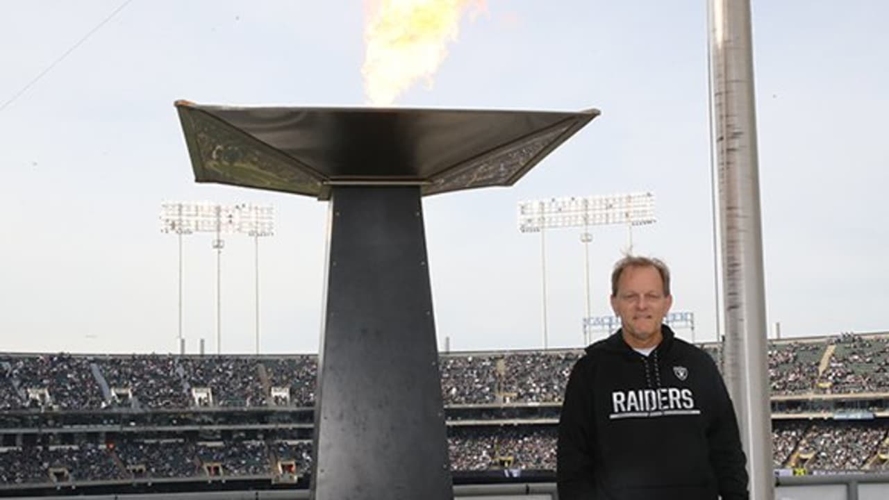 Bob Romanski Lights Torch in Honor of Al Davis