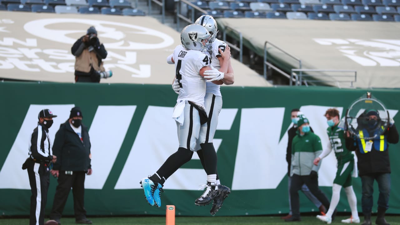 Derek Carr scrambles before rushing toward the pylon for the two-yard TD