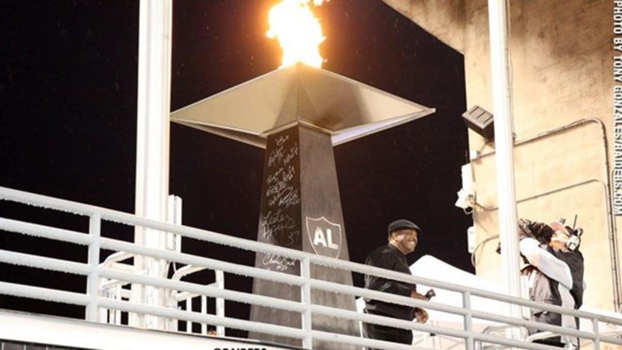 Joe Morgan lights Torch in honor of Al Davis