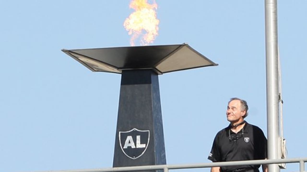 George Buehler Lights Torch in Honor of Al Davis