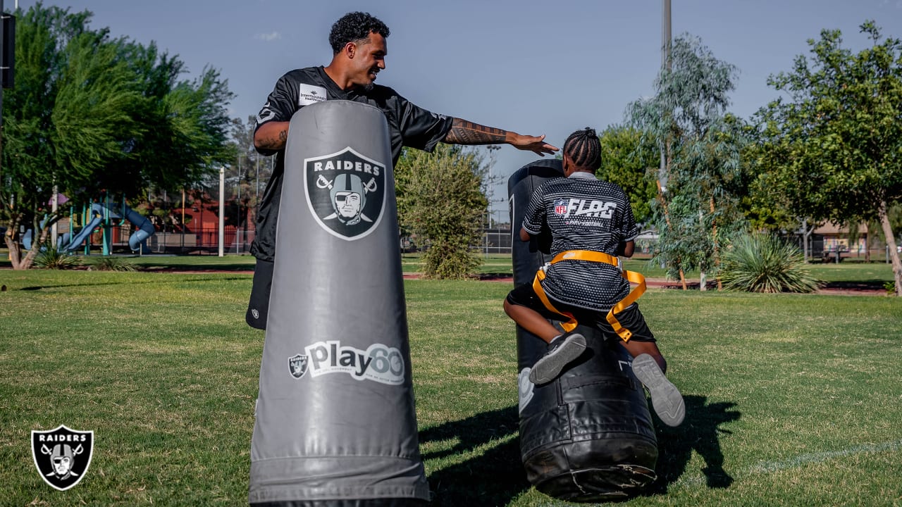 Raiders work with youth at flag football camp