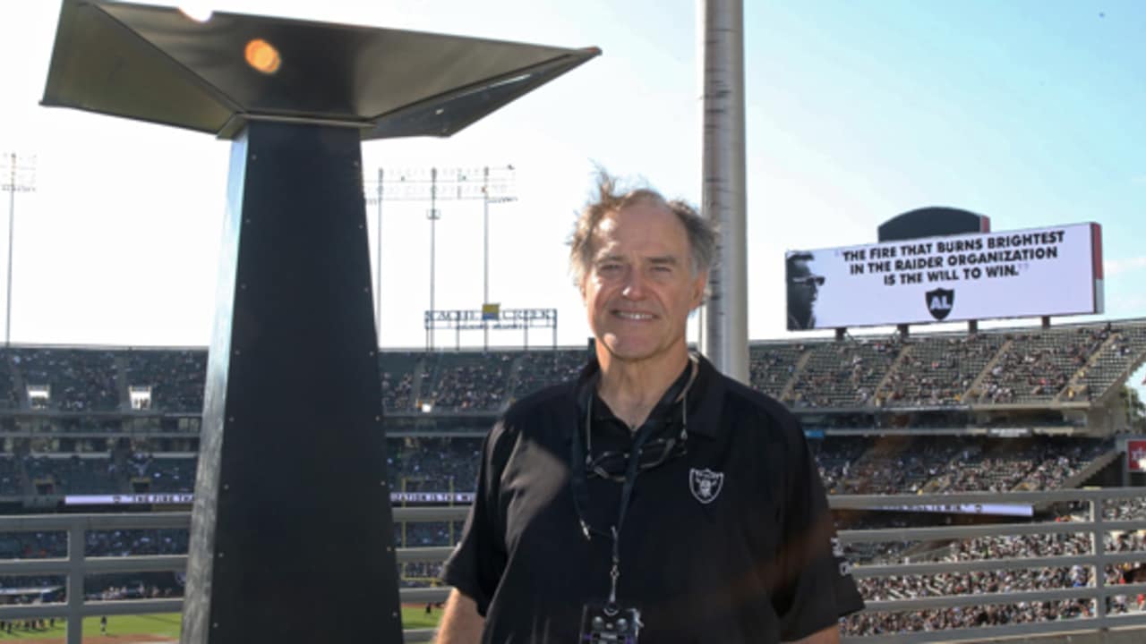 Super Bowl XI Champion George Buehler Lights Torch Honoring Al Davis