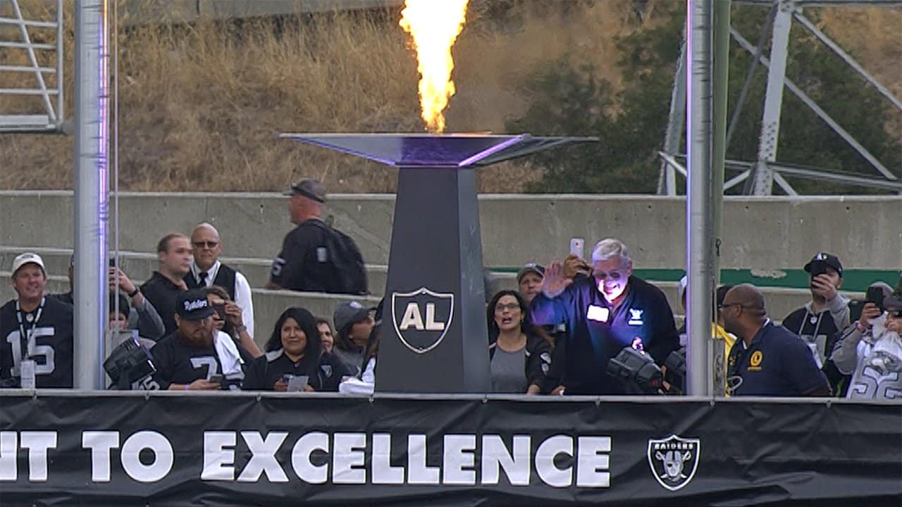 Kent McCloughan Lights Torch In Honor Of Al Davis