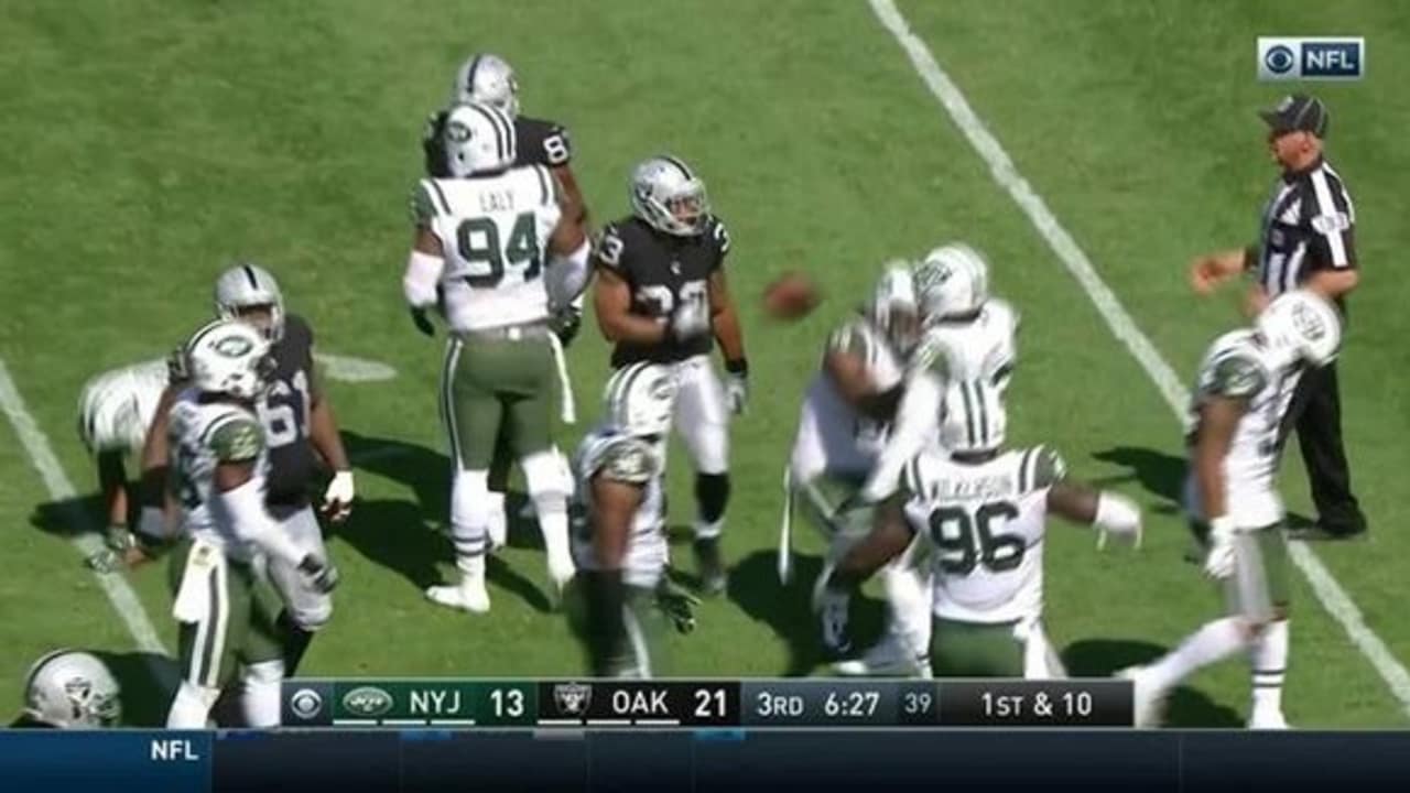 DeAndré Washington rushes for 10 yards with defenders on his back