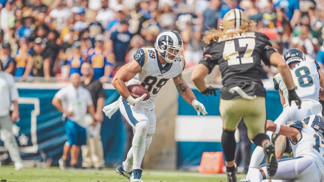 Higbee high-points leaping grab with defender in sight