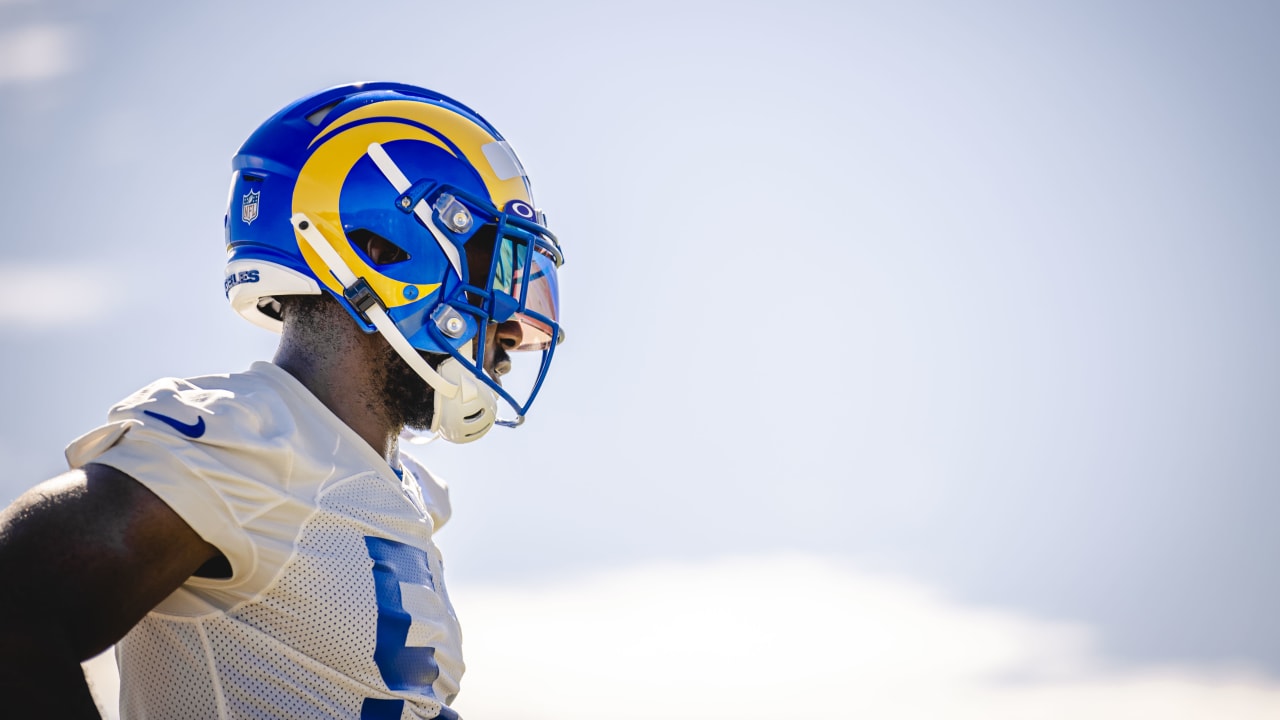 Rookie linebacker Terrell Lewis gets a message from Legend Mike Jones