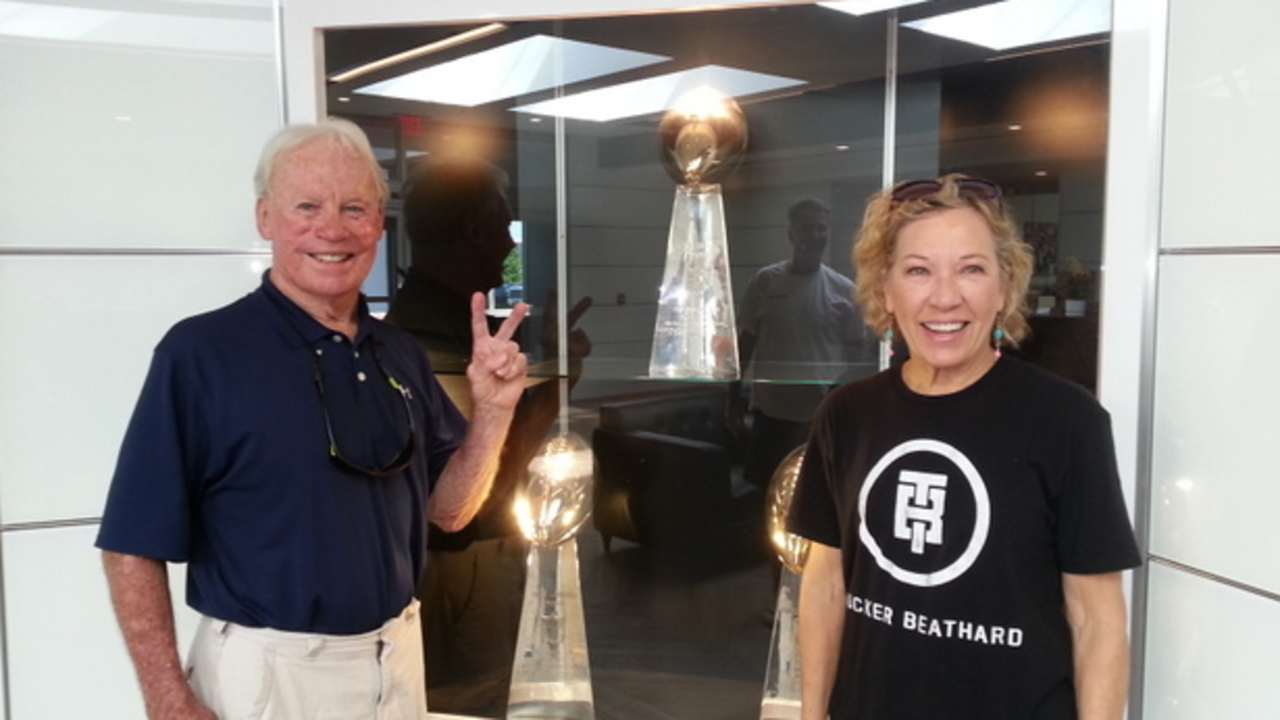Bobby Beathard Takes Photos By His Lombardi Trophies