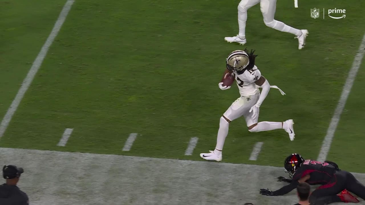 Saints WR Kevin White tightropes the sideline on the 64-yard gain ...