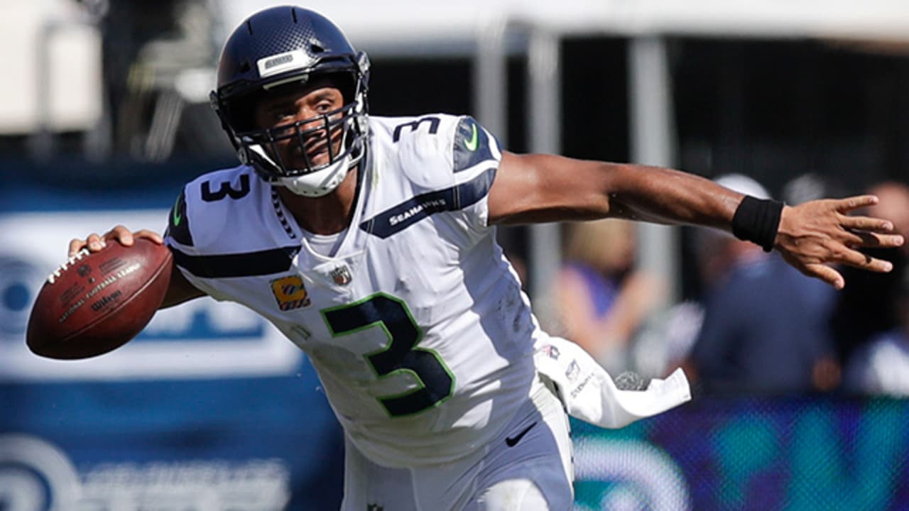 Russell Wilson Completes Pass While Falling To Ground