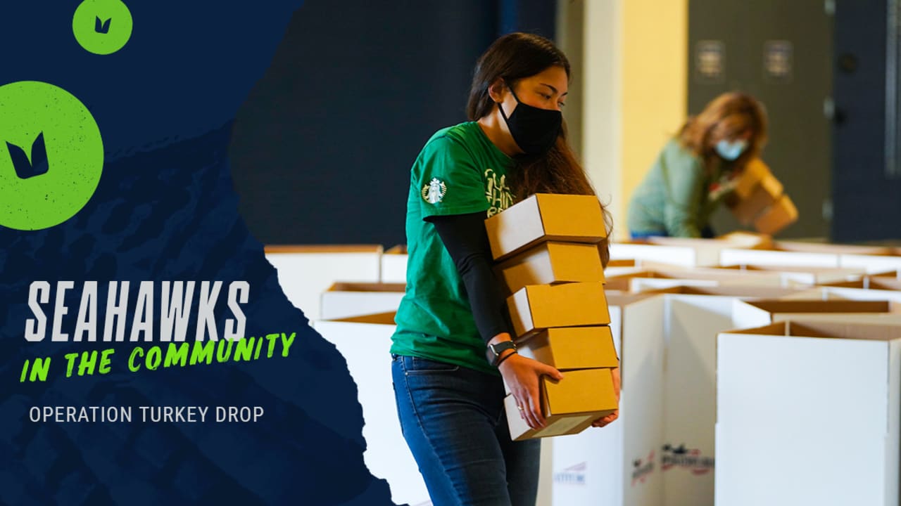 PHOTOS: Seahawks And Task Force 12 Hosts Operation Turkey Drop
