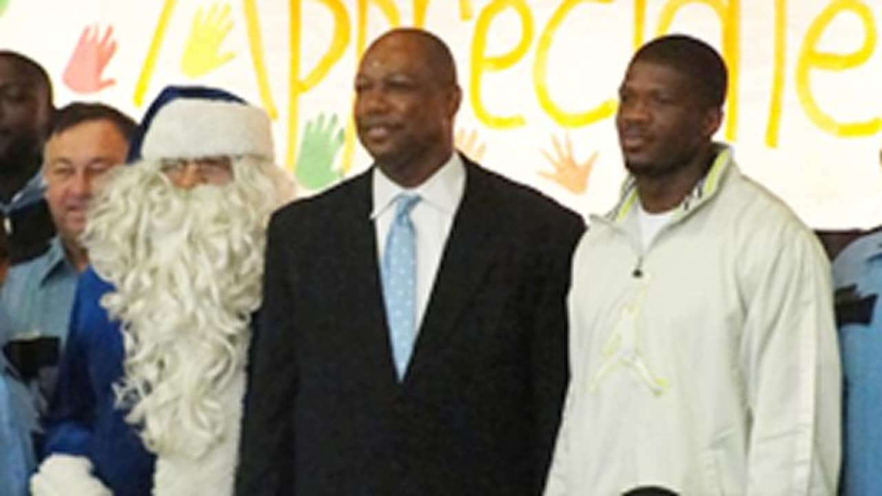 Johnson gives toys through Blue Santa program