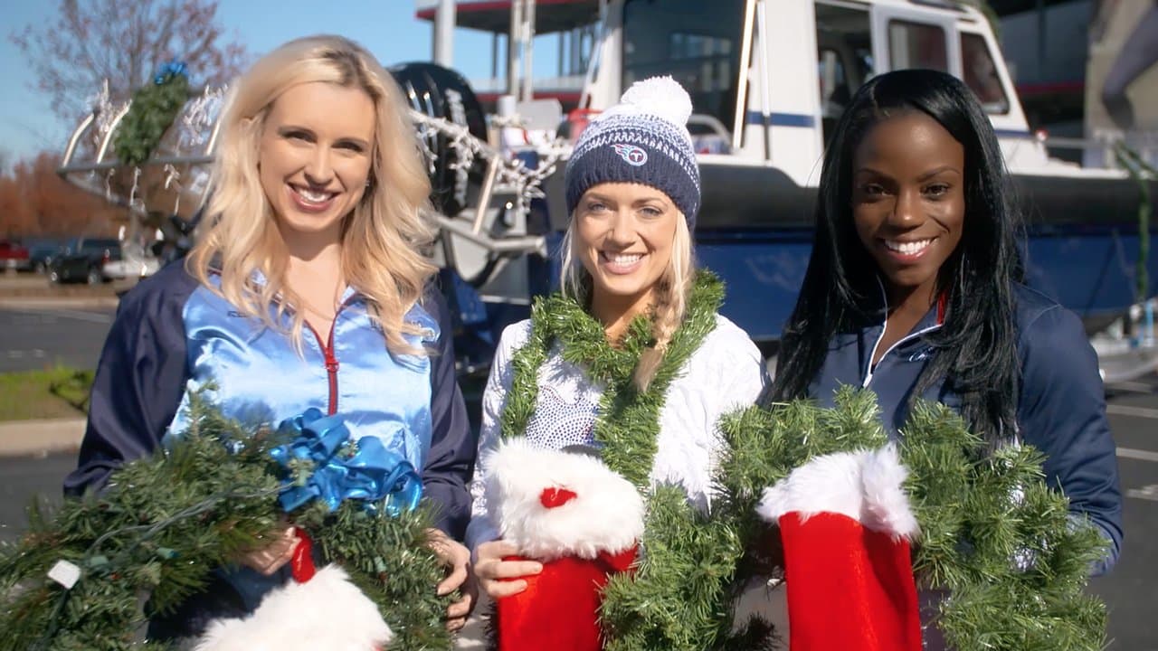 Cheerleaders Prepare Float for Christmas Parade