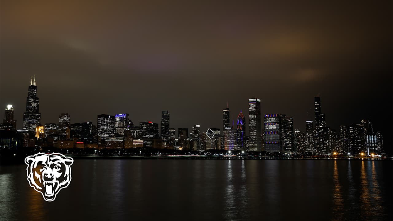 Soldier Field, Chicago skyline lit in blue and orange to support Bears