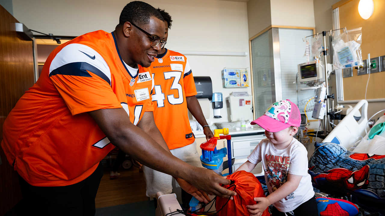 Photos: Broncos players visit kids and families at Children's Hospital ...