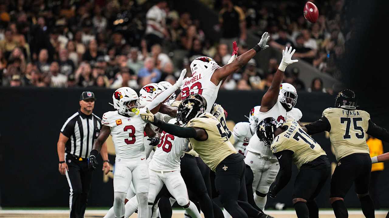 Cardinals DL Calais Campbell stays ahead of Panthers LS J.J. Jansen in ...