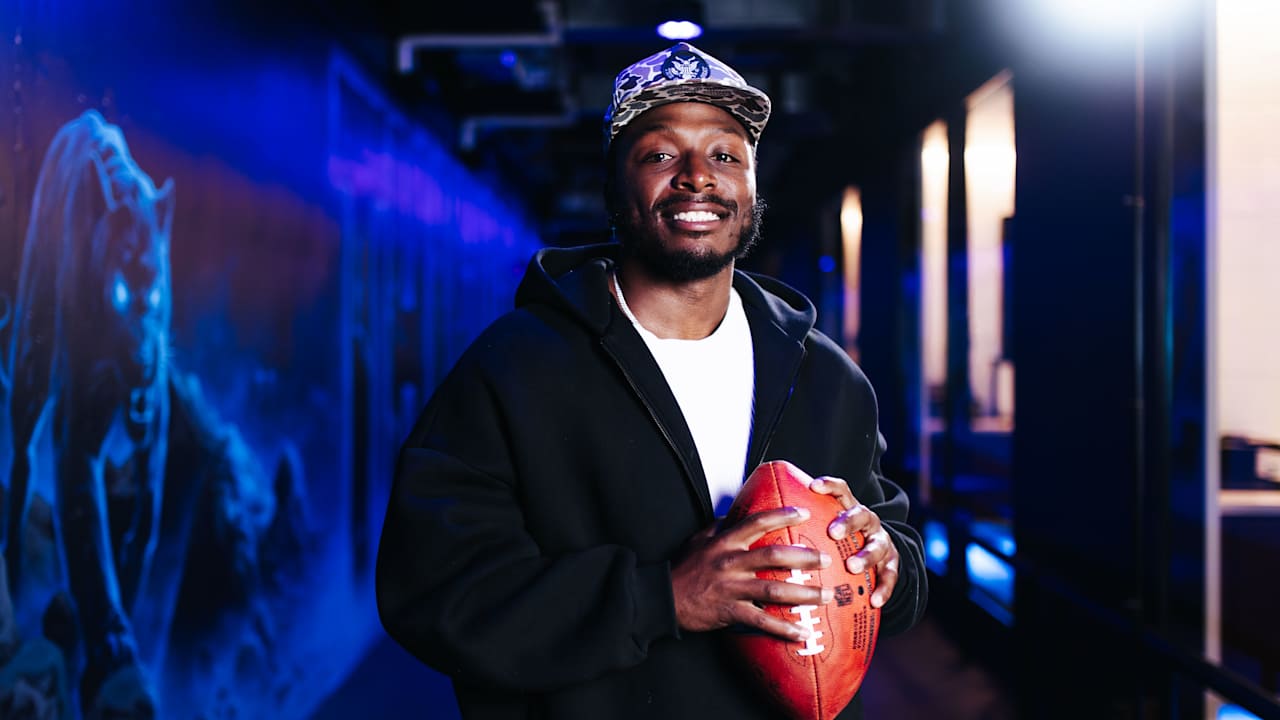 PHOTOS: David Moore officially re-signs with the Panthers