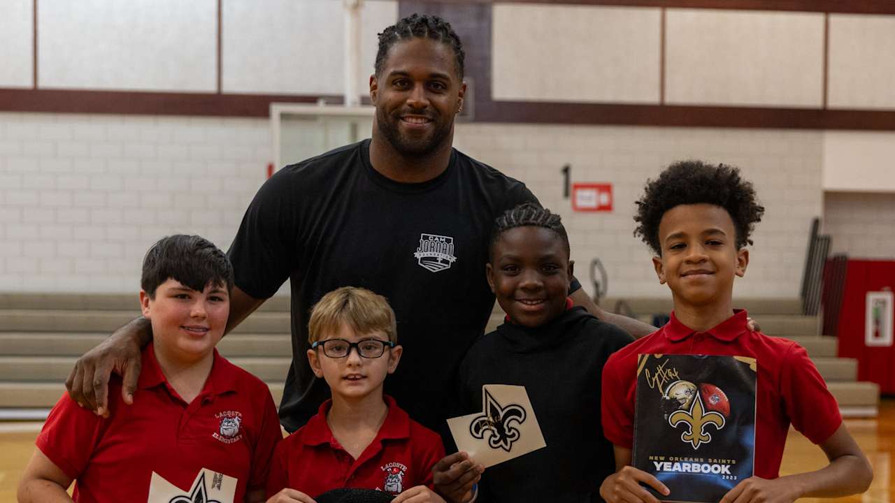 Photos: Cam Jordan visits Lacoste Elementary School
